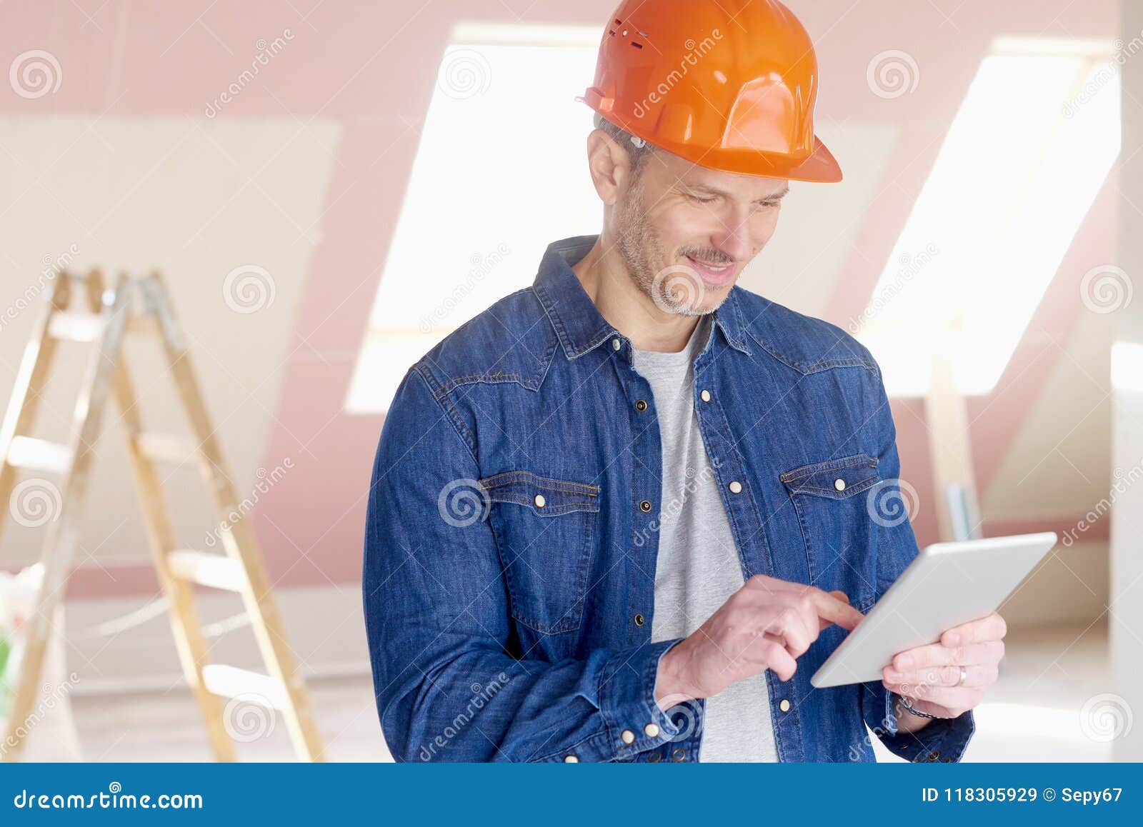Construction Worker Using Digital Tablet while Working Stock Image ...