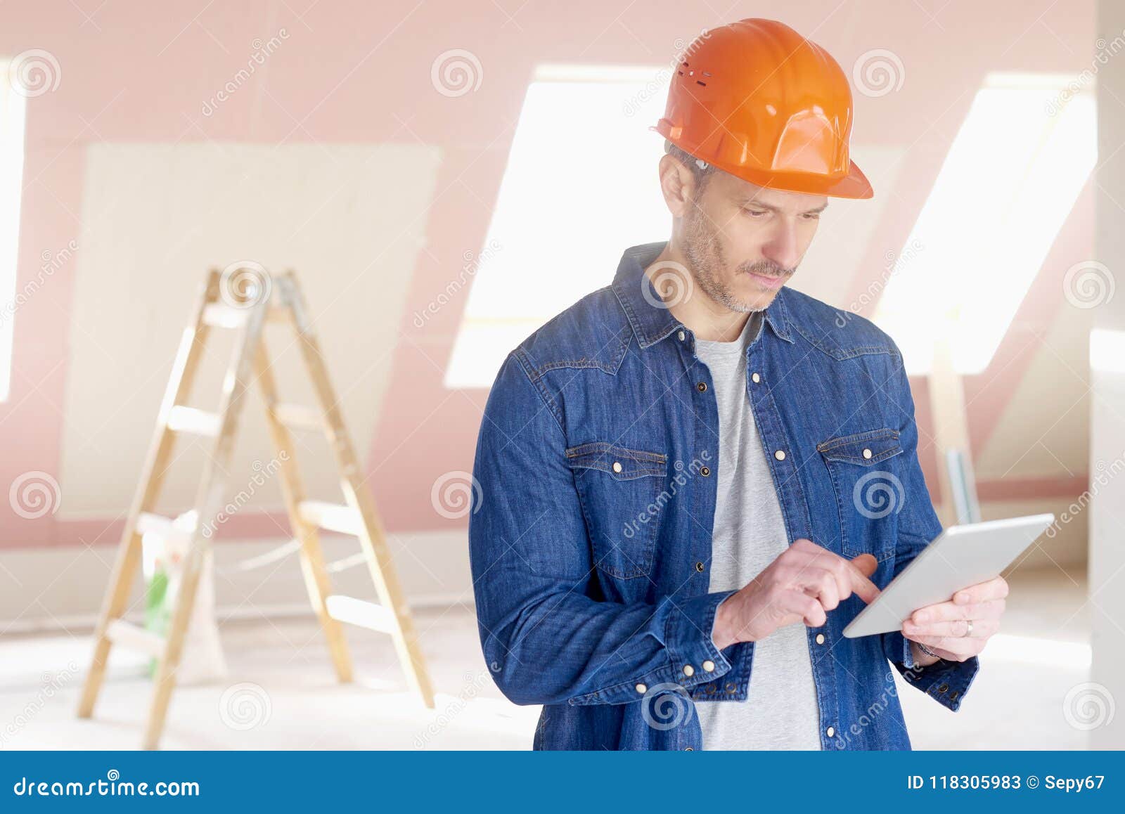 Construction Worker Using Digital Tablet while Working Stock Image ...