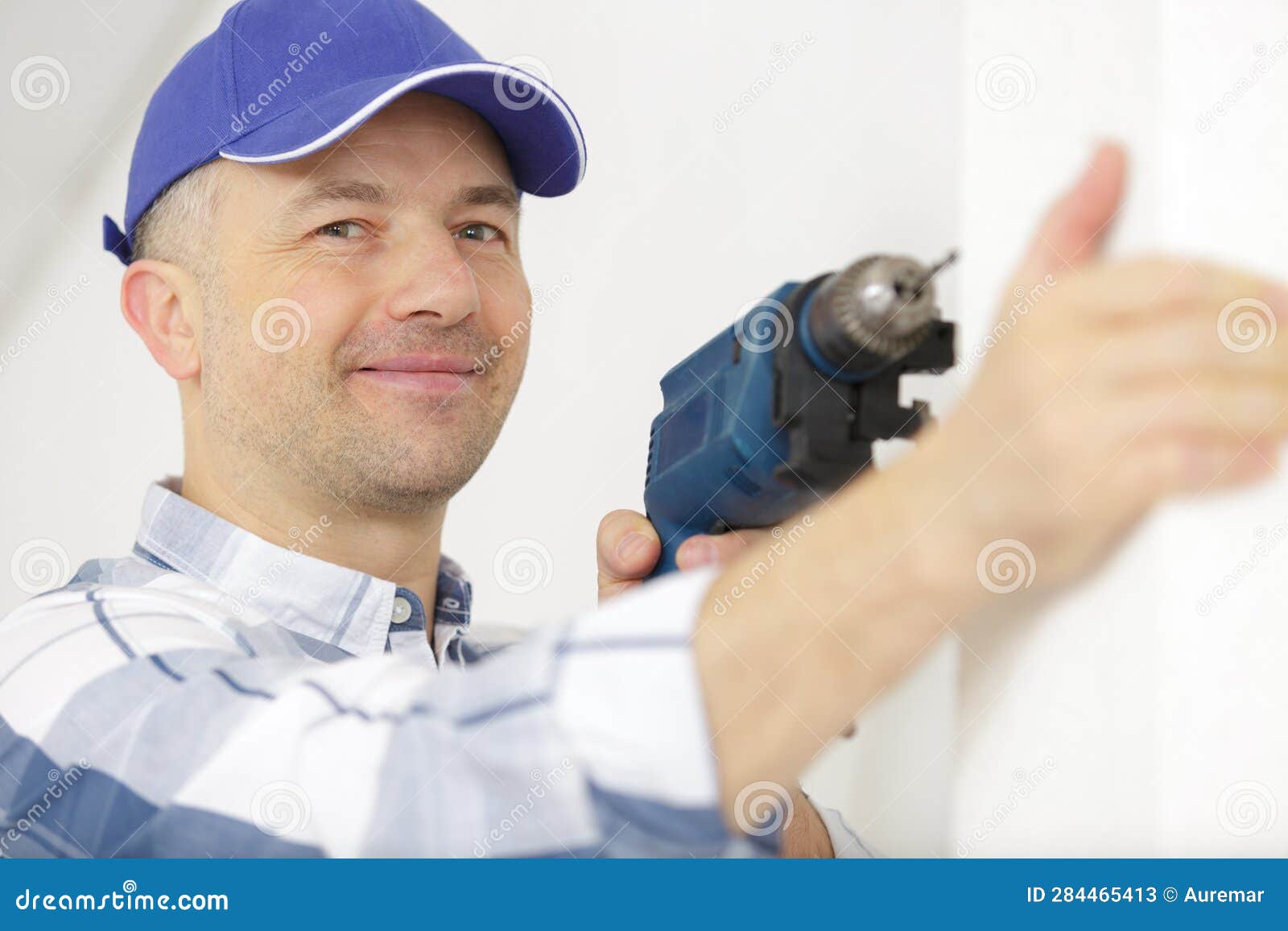 Construction Worker Using Electric Drill on Building Site Stock Image ...