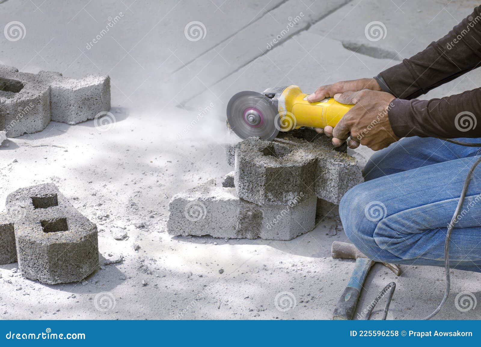 Construction Worker Using Electric Grinder Cutting Turf Stone Block in ...
