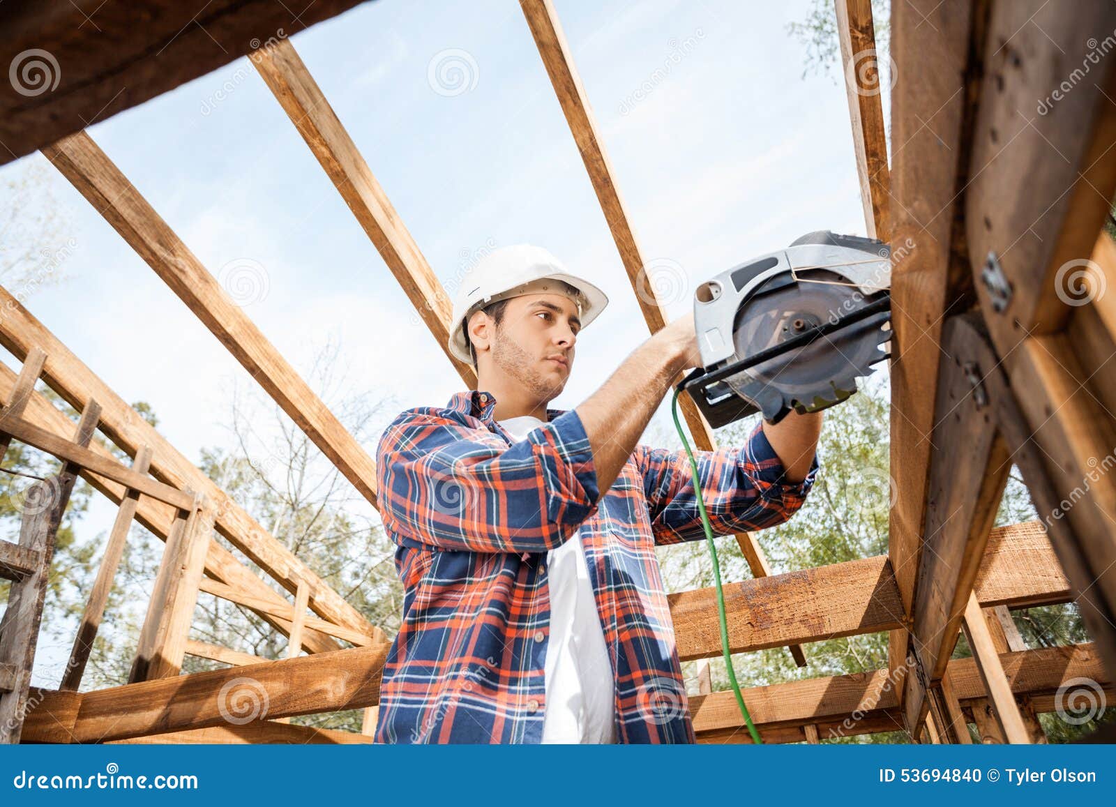 Construction Worker Using Electric Saw on Timber Stock Photo - Image of ...