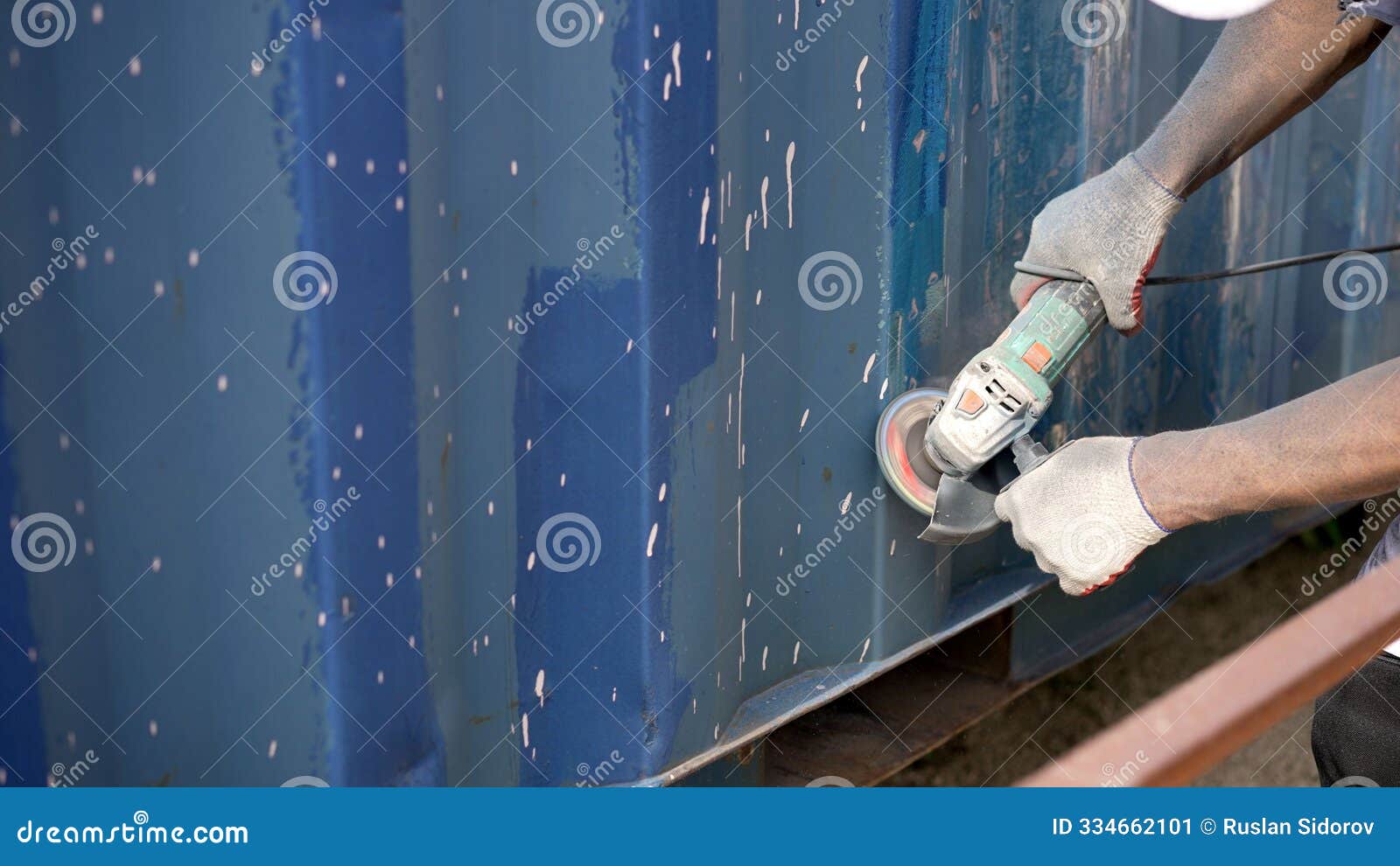 Construction Worker Removing Rust from Metal Surface Using Grinding ...