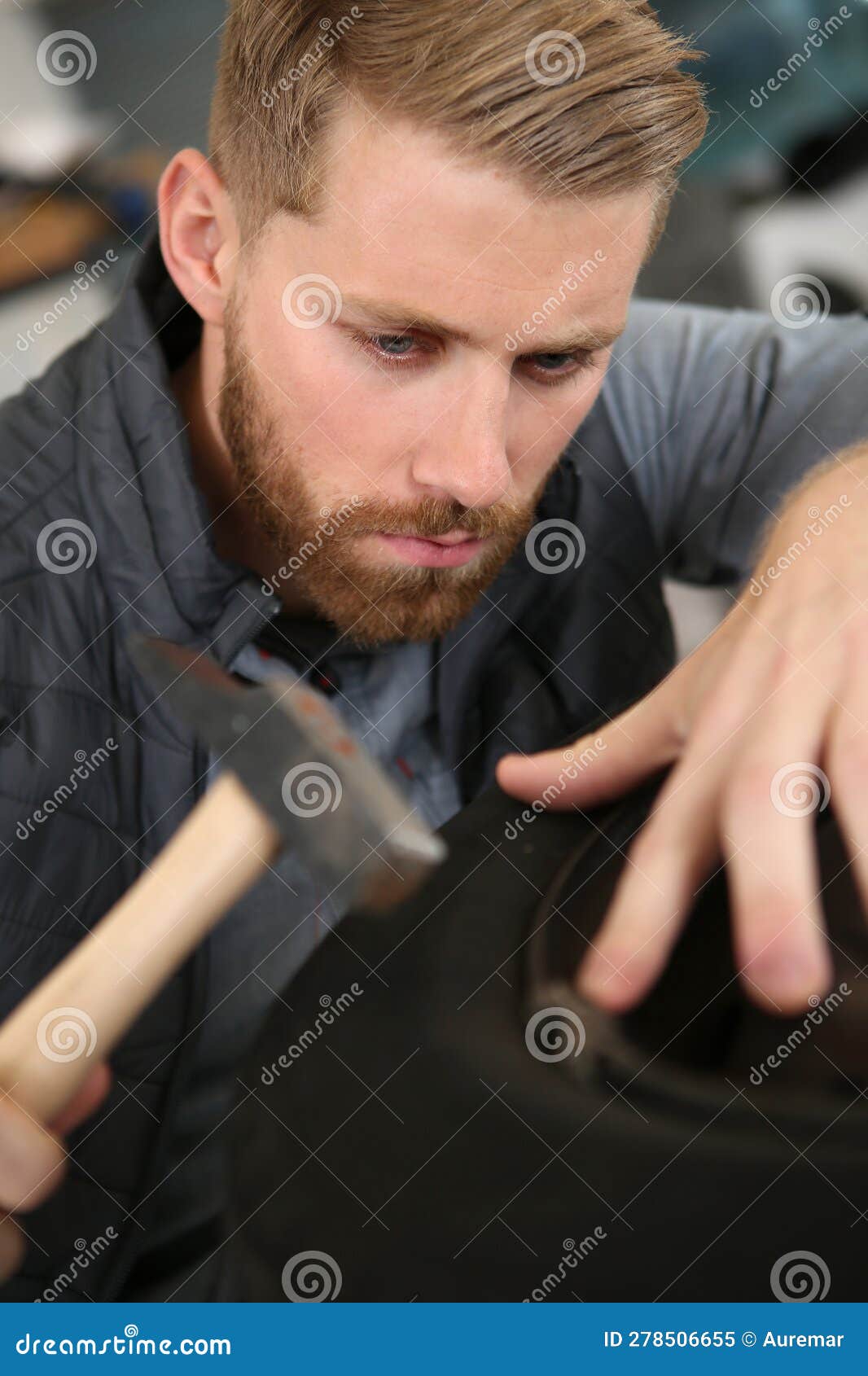 Construction Worker Using Hammer at Construction Site Stock Image ...