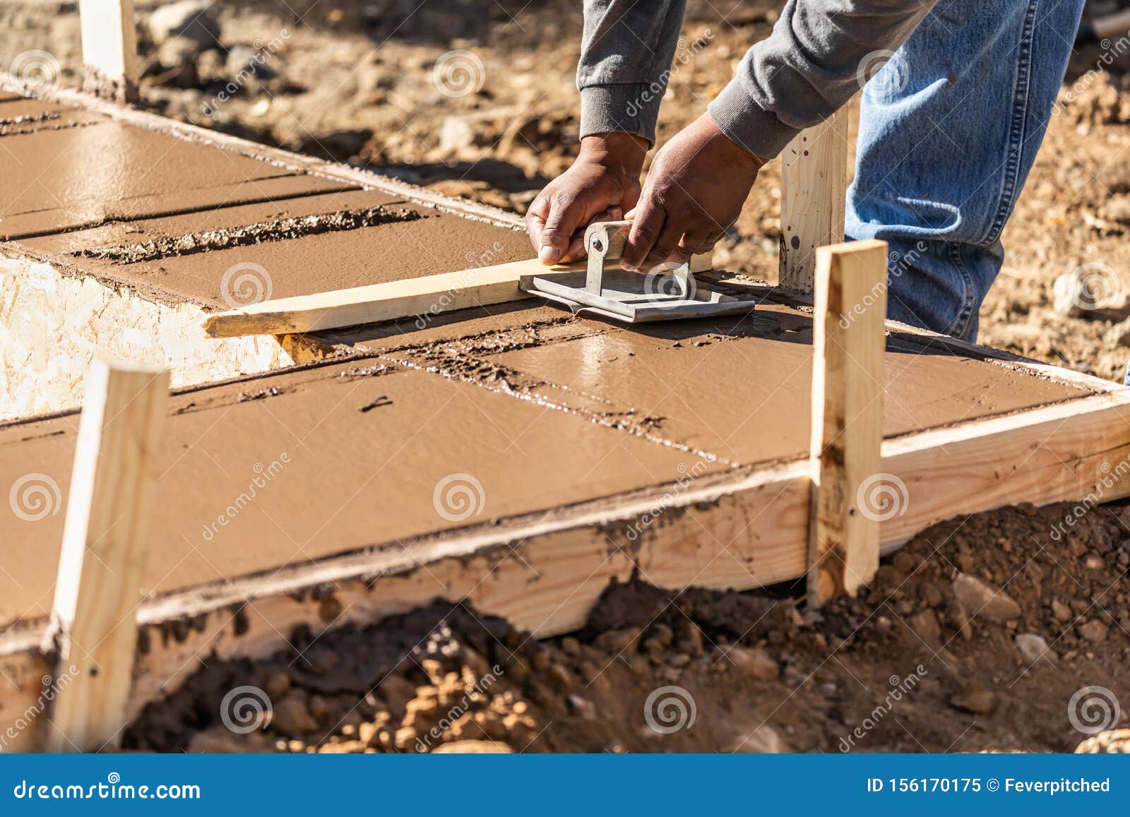 Construction Worker Using Hand Groover on Wet Cement Forming Coping ...