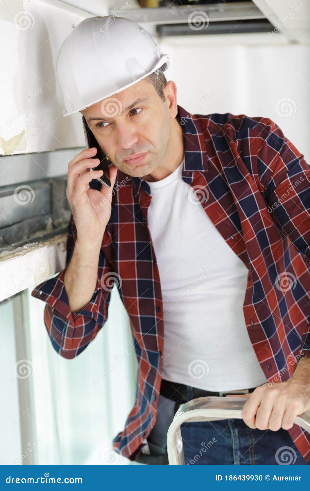 Construction Worker Using Mobile Phone Stock Photo - Image of looking ...