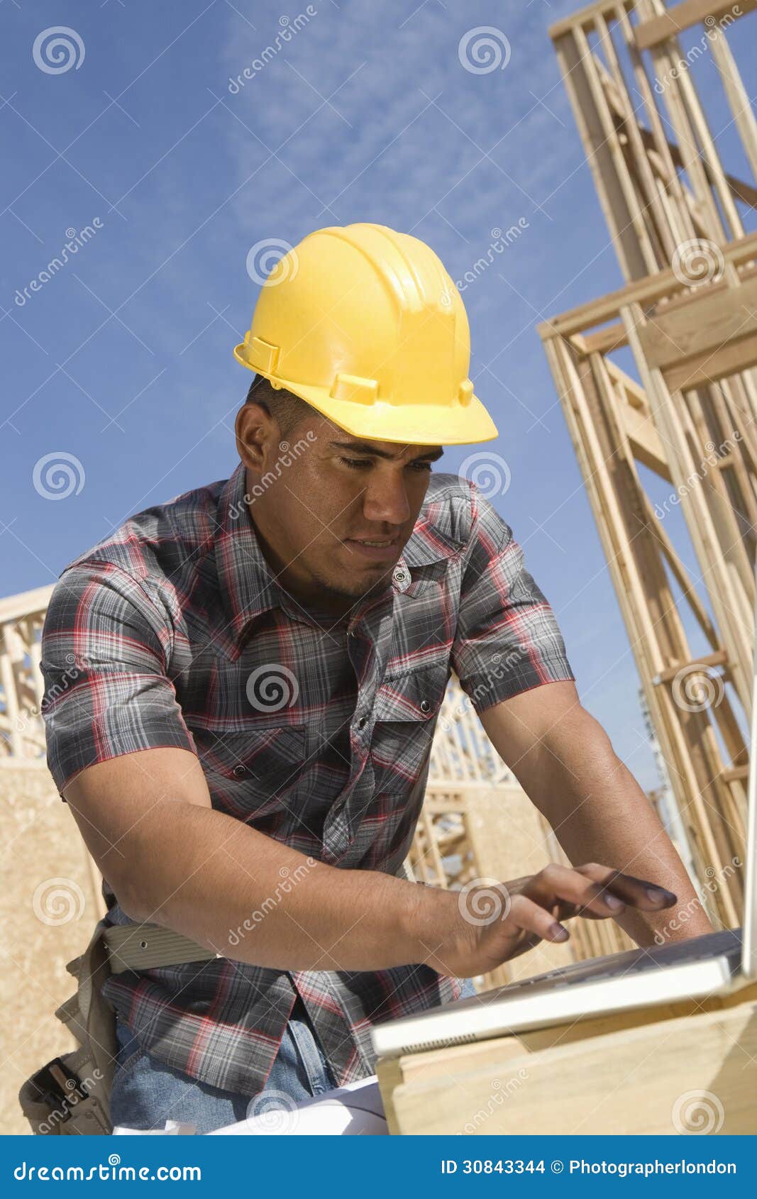 Construction Worker Using Laptop Stock Photo - Image of hardhat ...