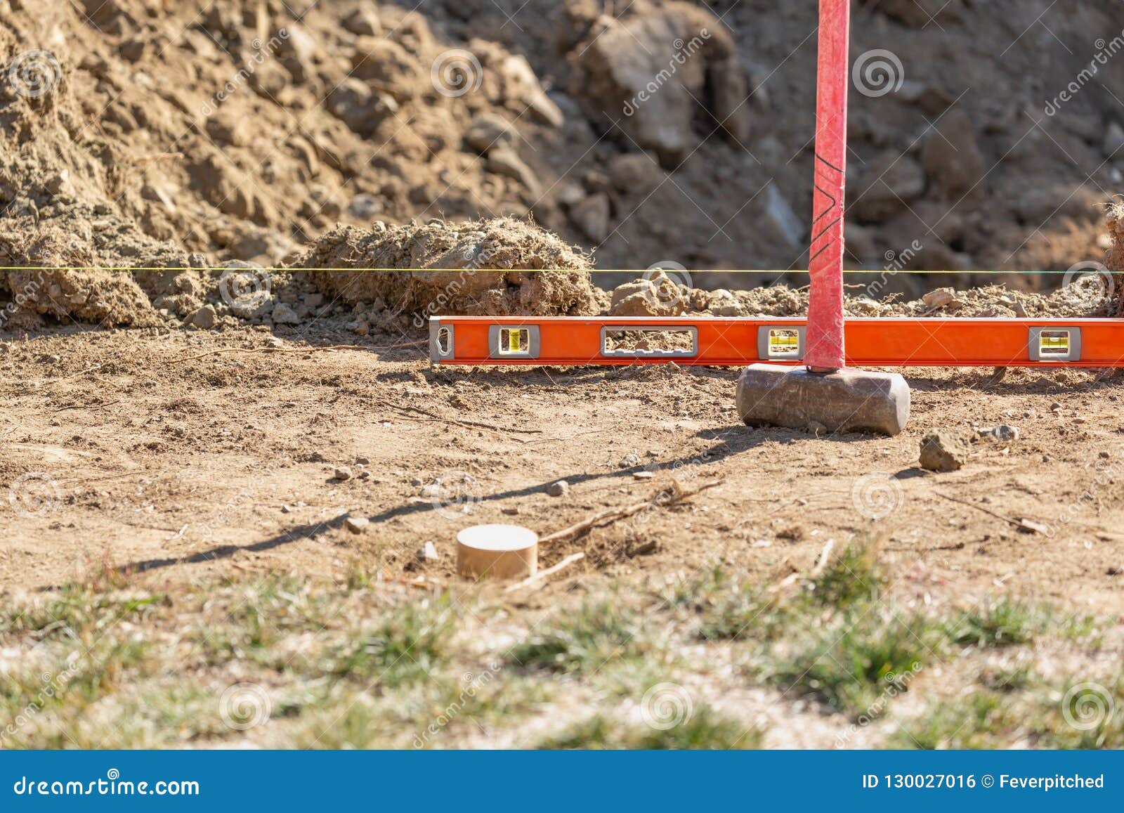 Construction Worker Using Level at a Job Site Stock Photo - Image of ...