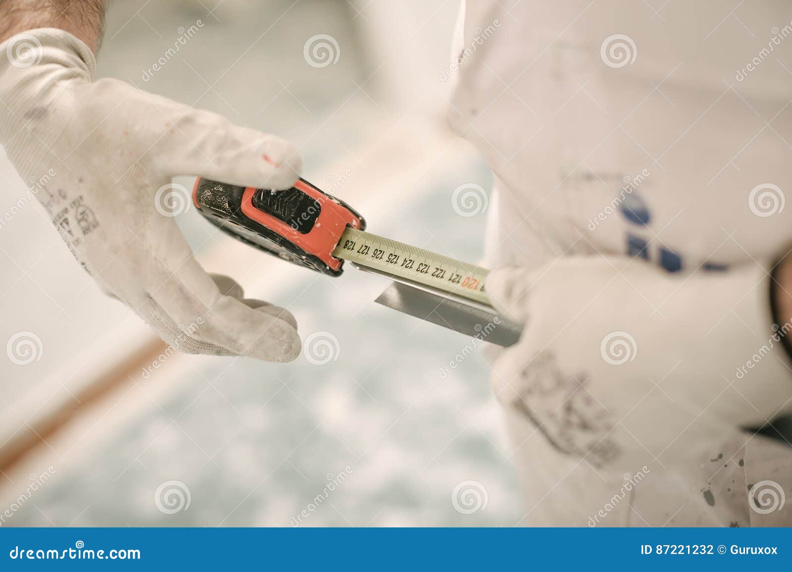 Construction Worker Using Measuring Tape Stock Photo - Image of holding ...