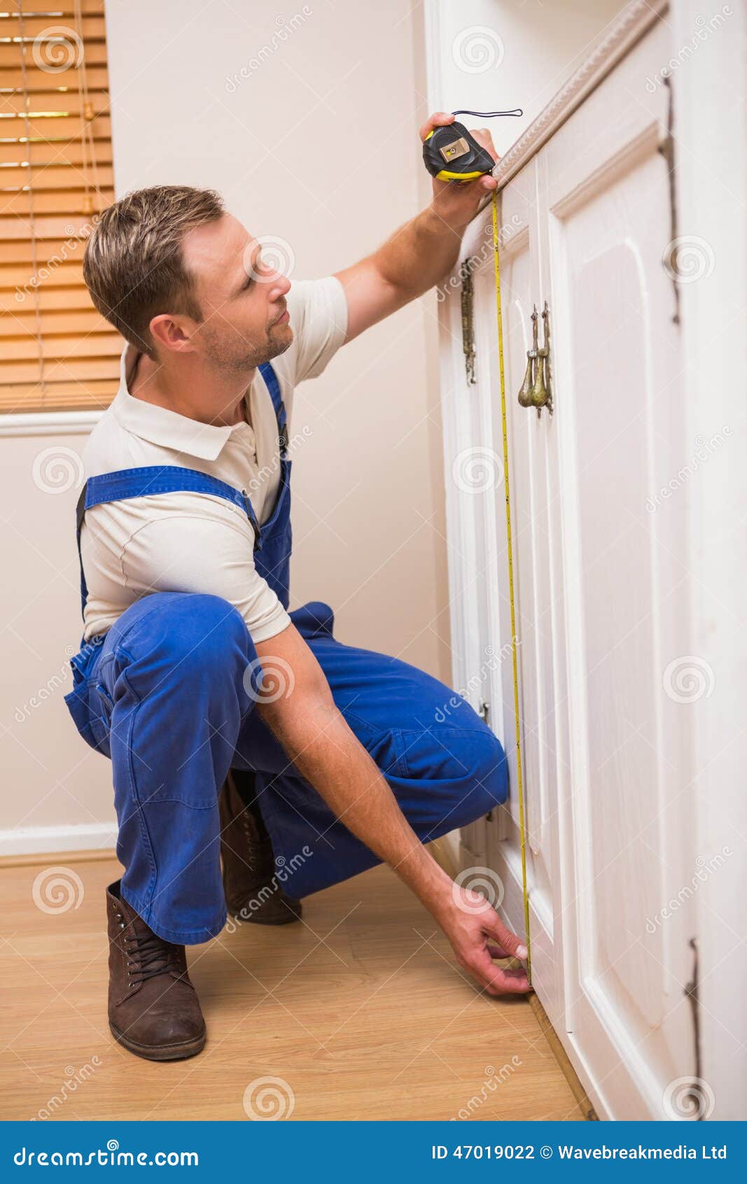 Construction Worker Using Measuring Tape Stock Photo - Image of person ...