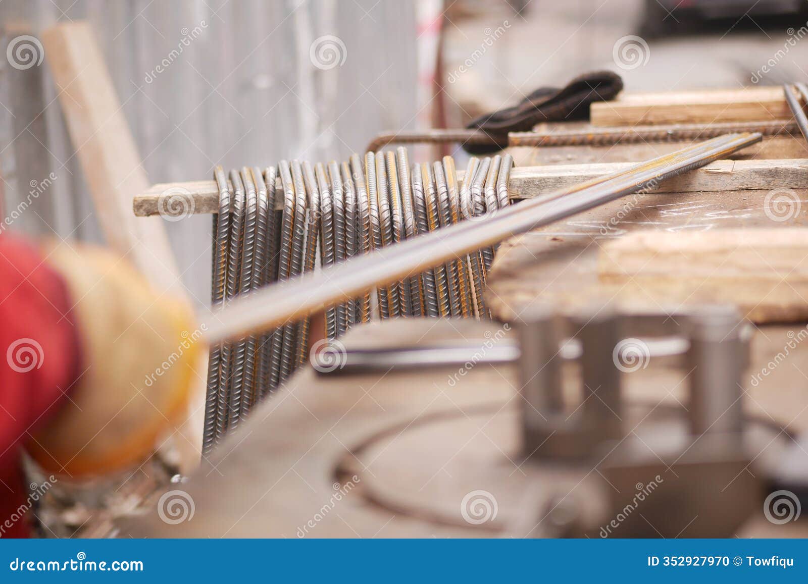 Construction Worker Using Metalwork Equipment on Steel Rods at Worksite ...