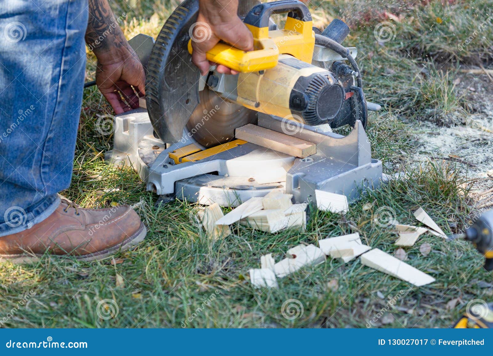 Construction Worker Using Miter Saw at a Job Site Stock Image - Image ...