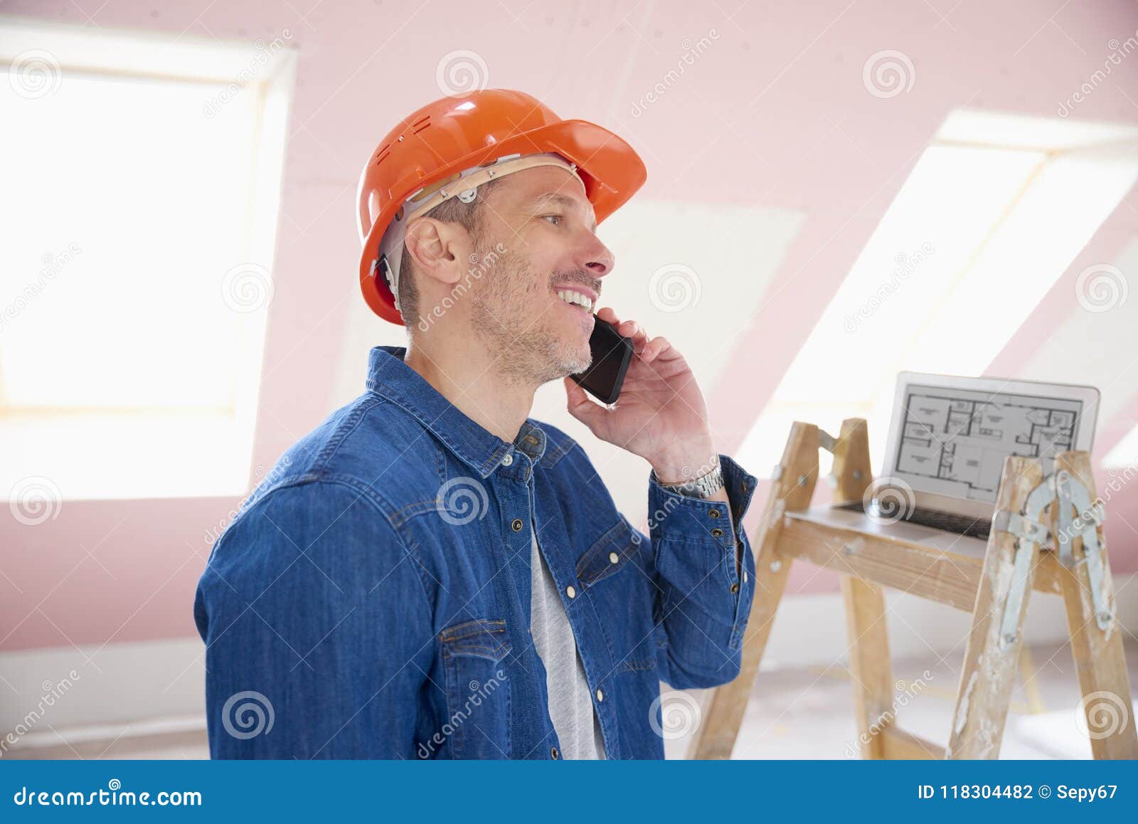 Construction Worker Using Mobile Phone Stock Photo - Image of phone ...