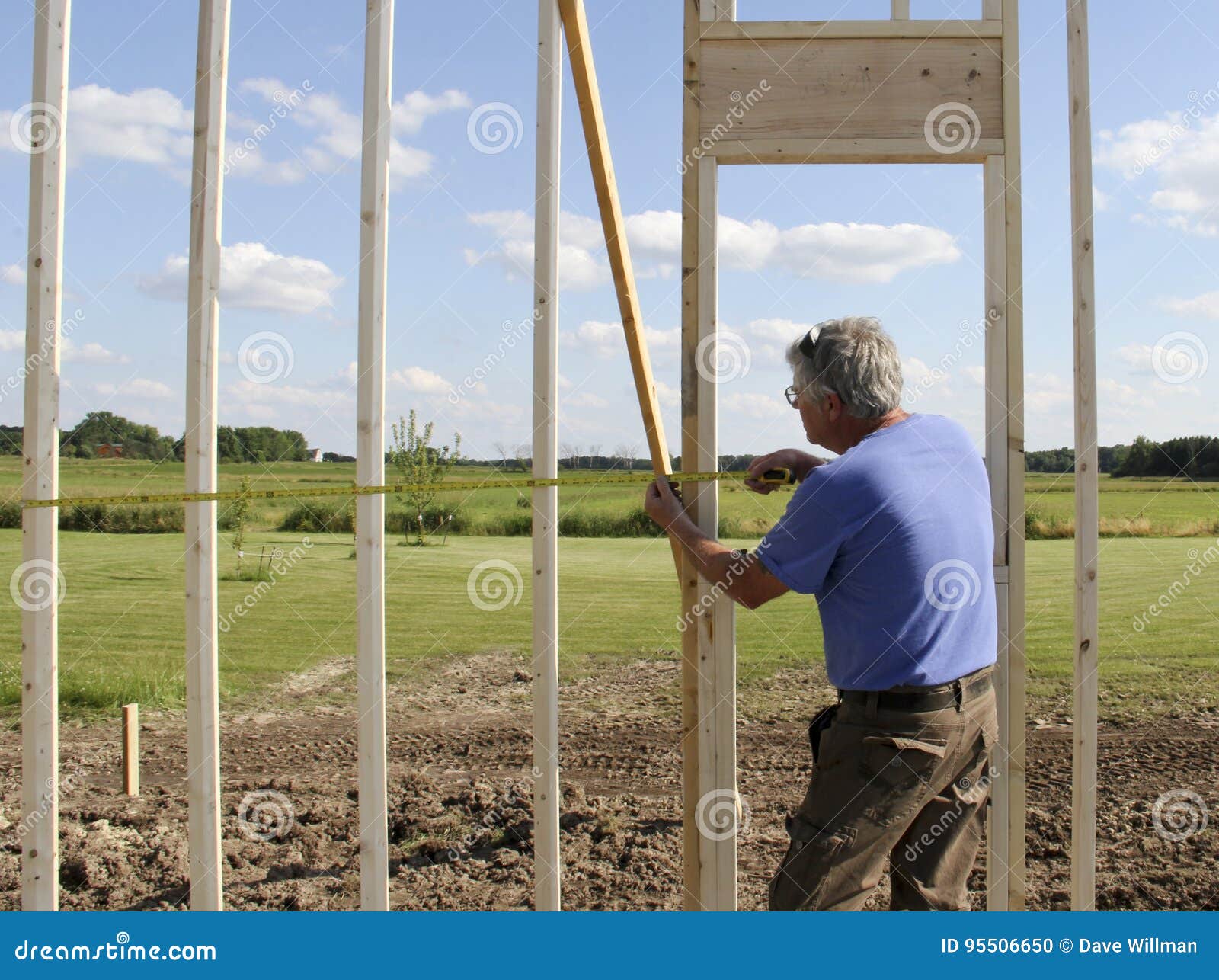 Construction Worker Using a Ruler Stock Photo - Image of building ...
