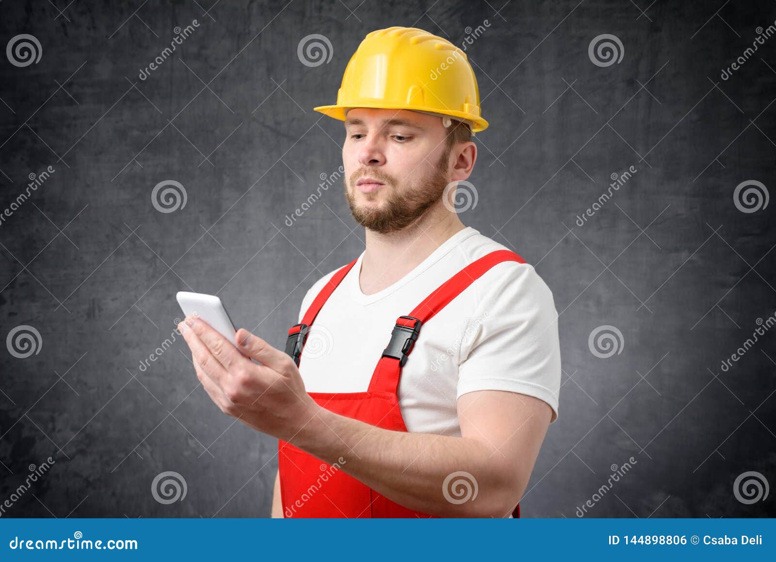 Construction Worker Using Smartphone Stock Photo - Image of looking ...