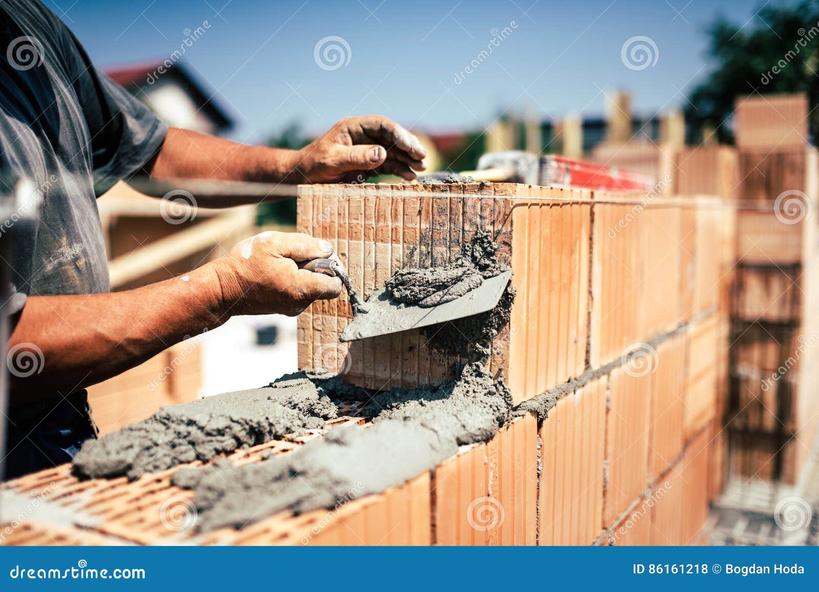 Construction Worker Using Spatula and Trowel for Building Walls with ...