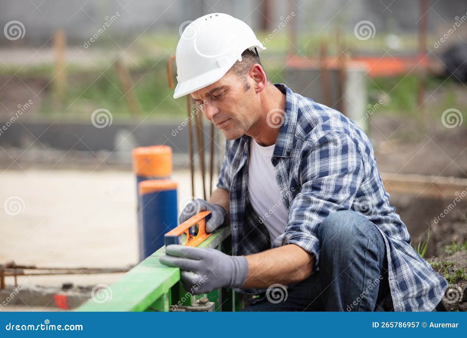 Construction Worker Using Spirit Level on Site Stock Image - Image of ...