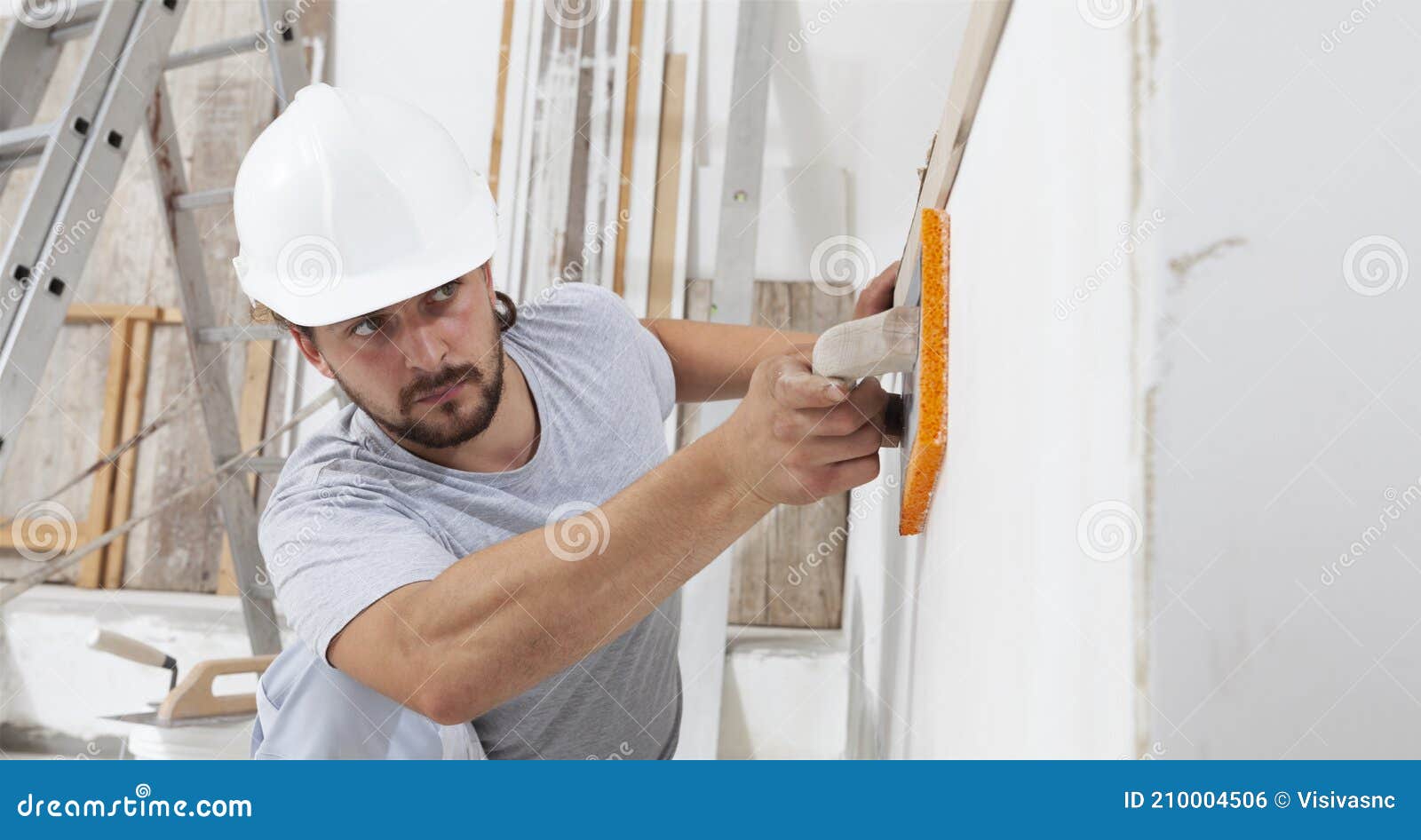 Construction Worker are Using Sponge and Plastering Trowel To Smooth ...