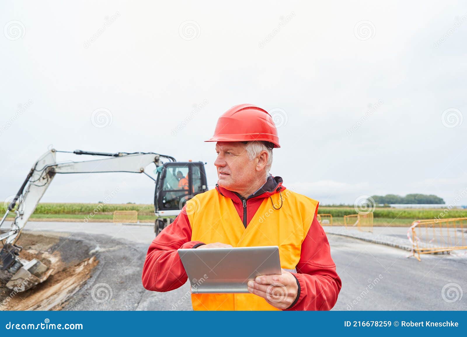 Construction Worker Using Tablet Computer on Construction Site Stock ...
