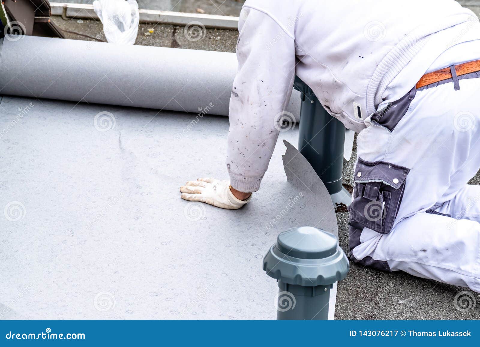Construction Worker Using Tarpaulin As Covering Sheet To Protect the ...