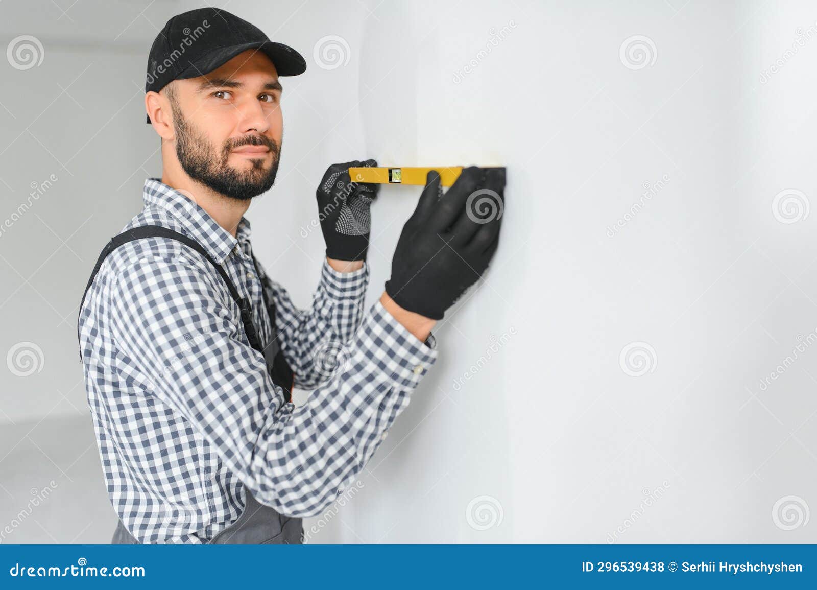 Construction Worker Using a Water Level. Stock Photo - Image of ...