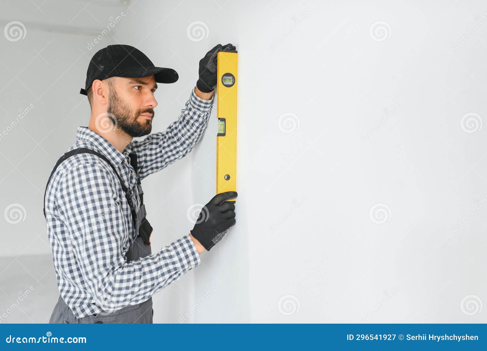Construction Worker Using a Water Level. Stock Image - Image of ...