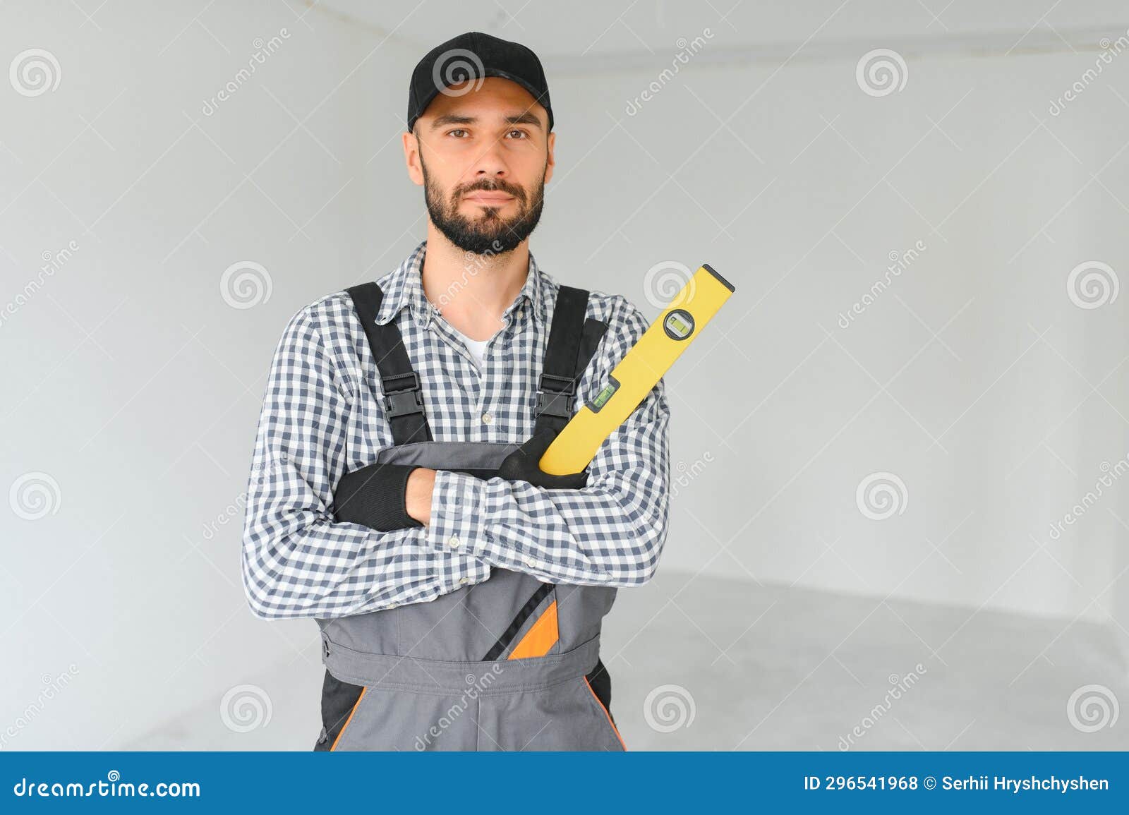 Construction Worker Using a Water Level. Stock Photo - Image of ...