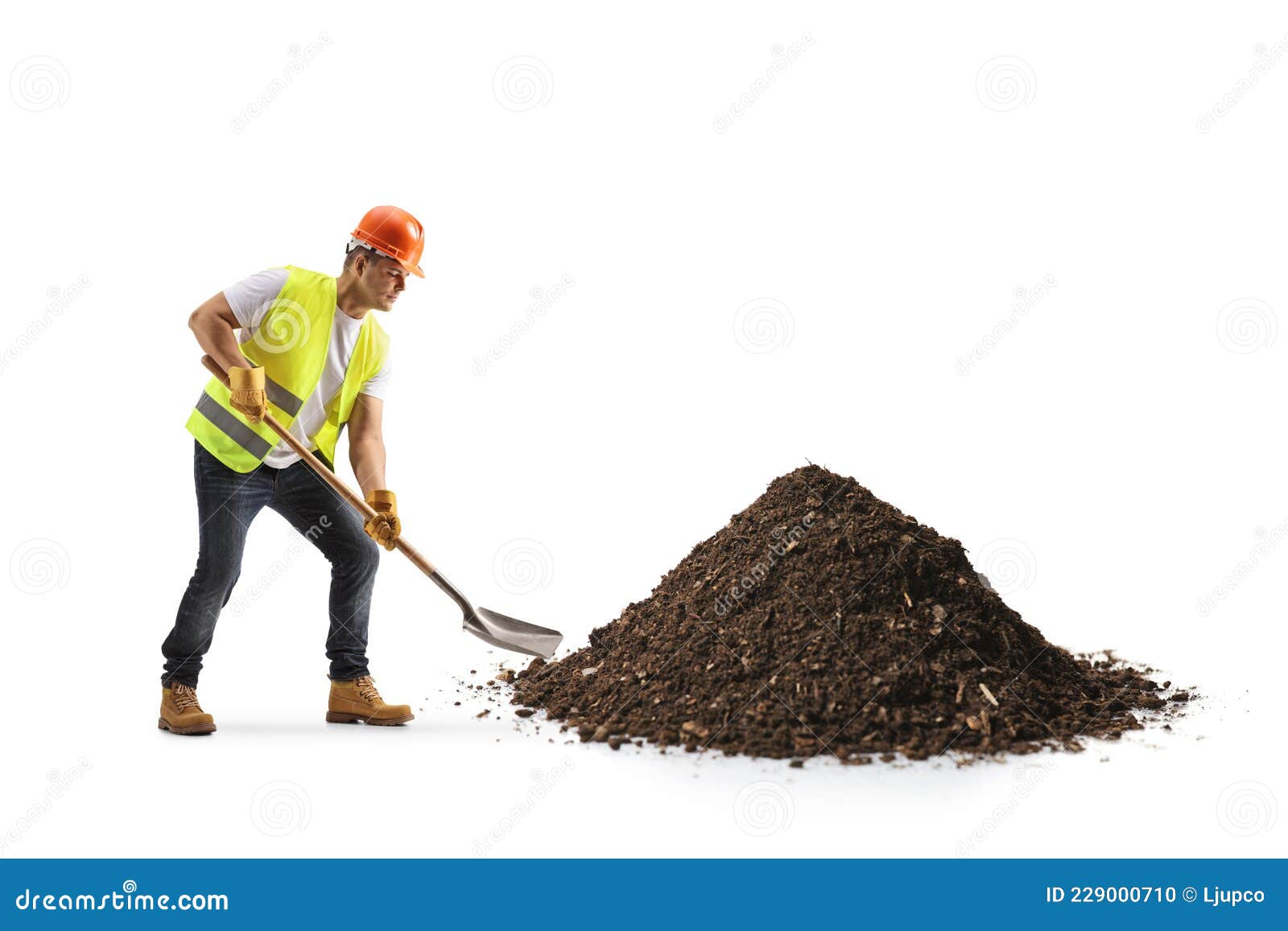 Construction Worker with a Vest and Hardhat Digging Earth with a Shovel ...