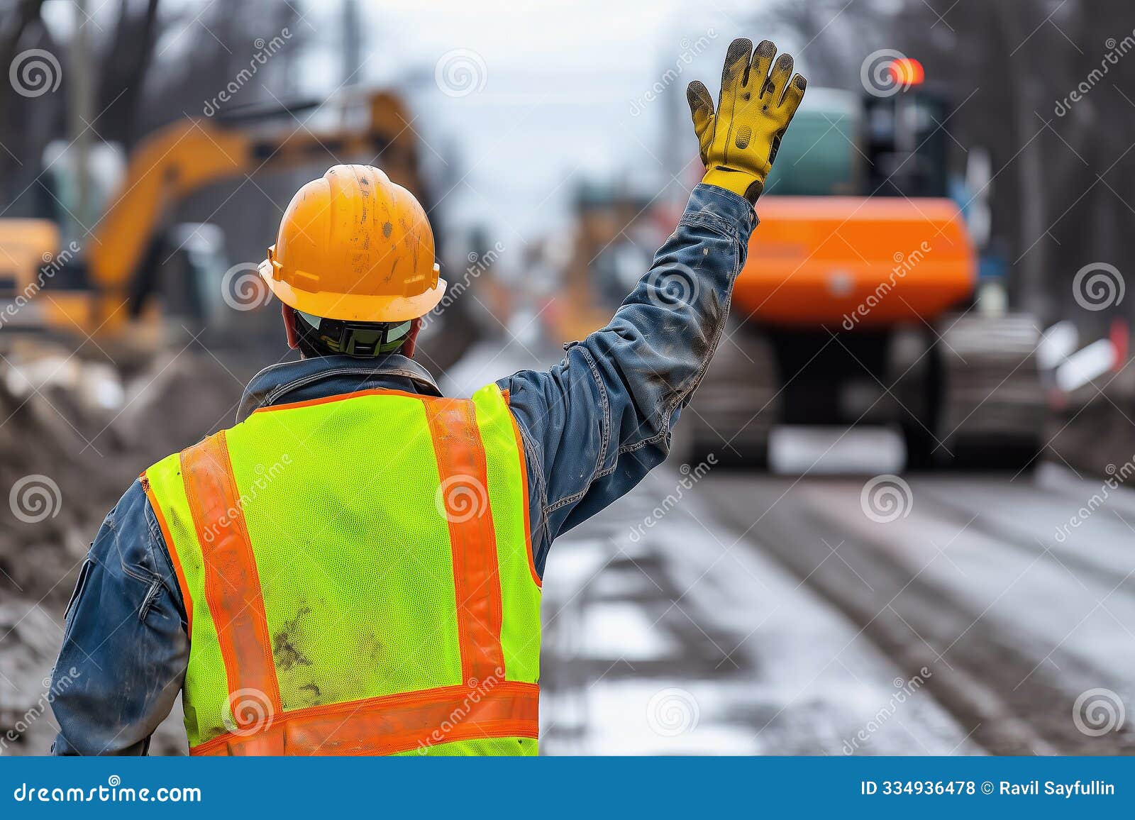 Construction Worker Guiding Traffic on a Roadwork Site Stock Photo ...