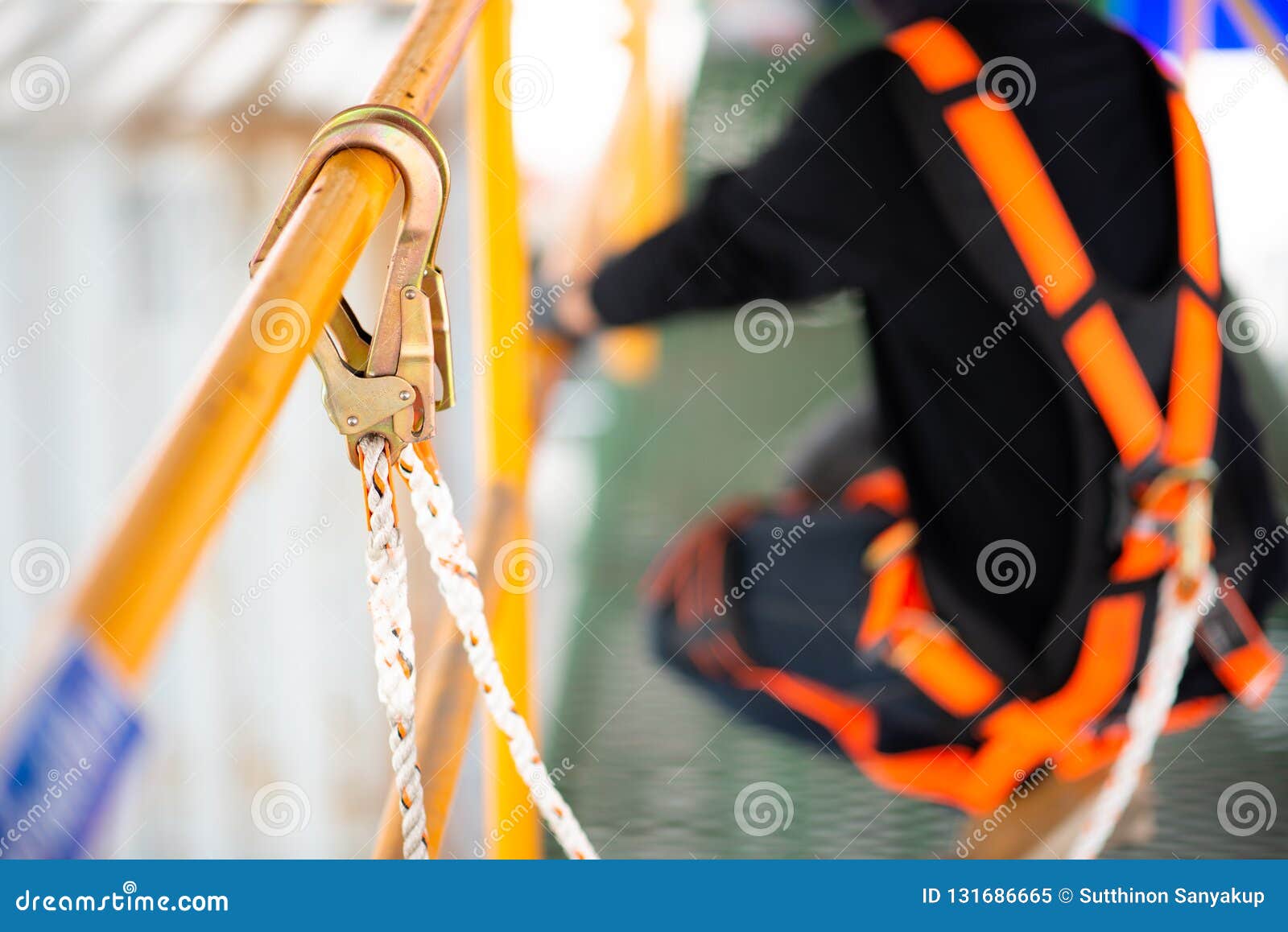 Construction Worker Wearing Safety Harness and Safety Line Working on ...
