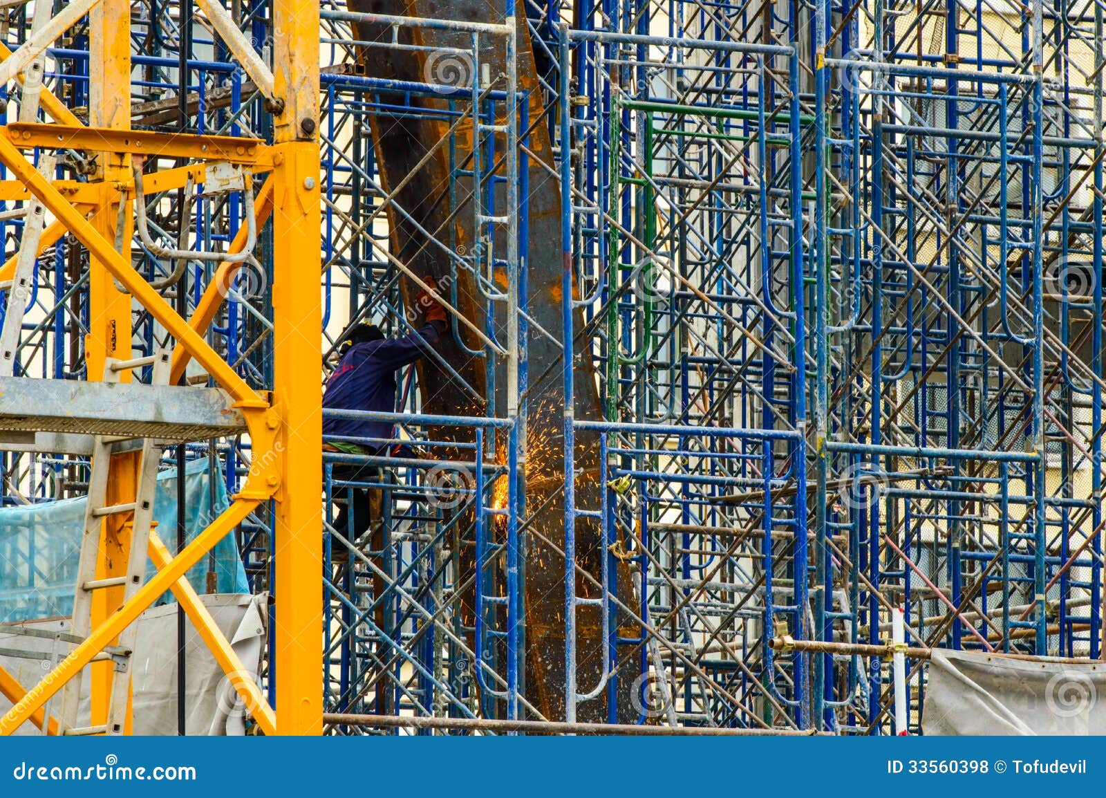 A Construction Worker Welding Steel Bars. Stock Photo - Image of ...