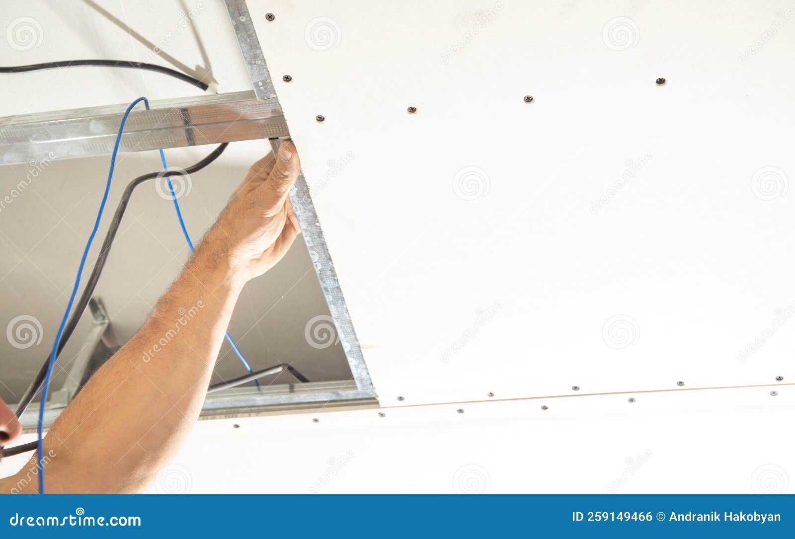 Construction Worker Working on Ceiling at Home Stock Photo - Image of ...