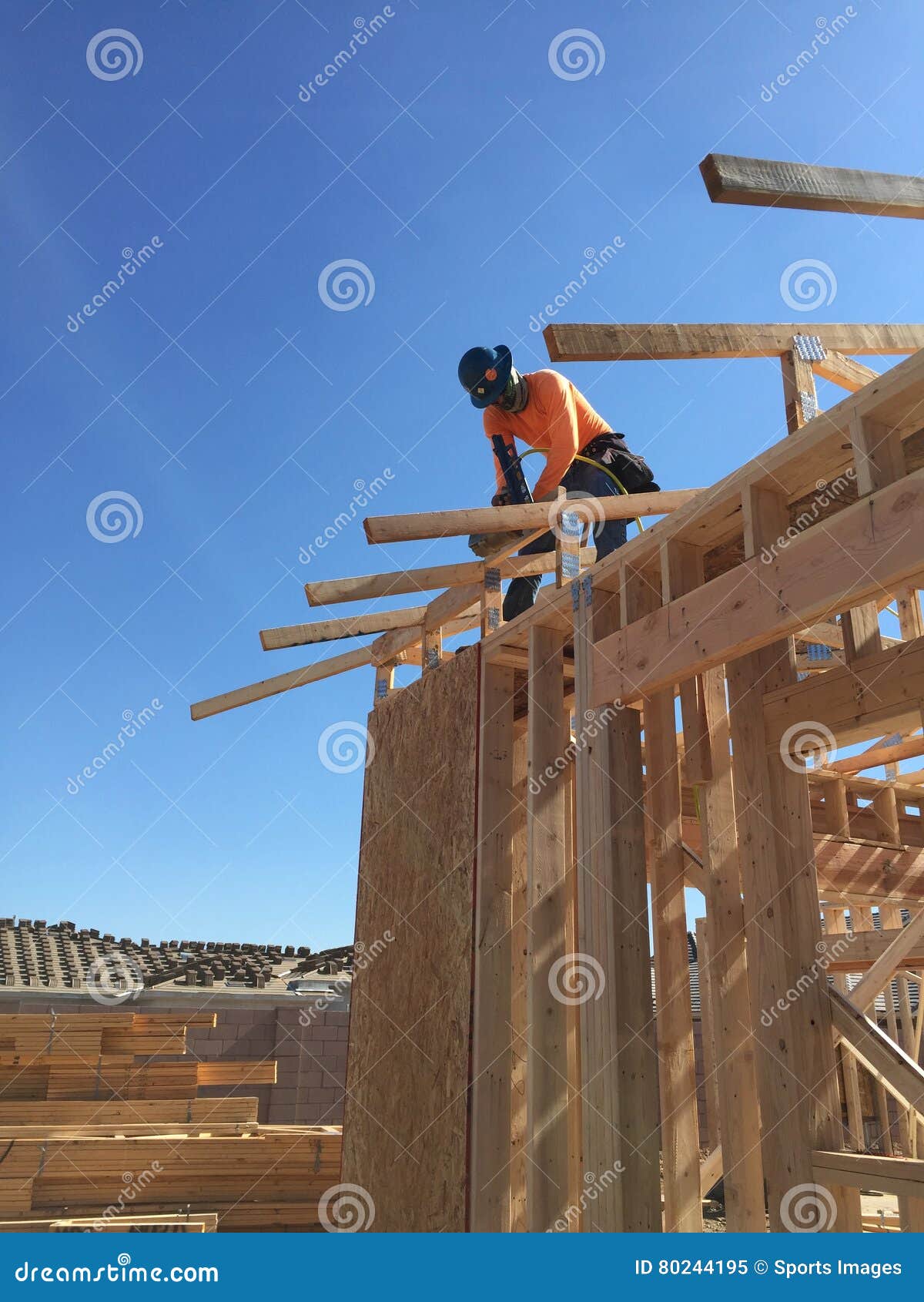 Construction Worker Working on the Framing Process for a New a House ...