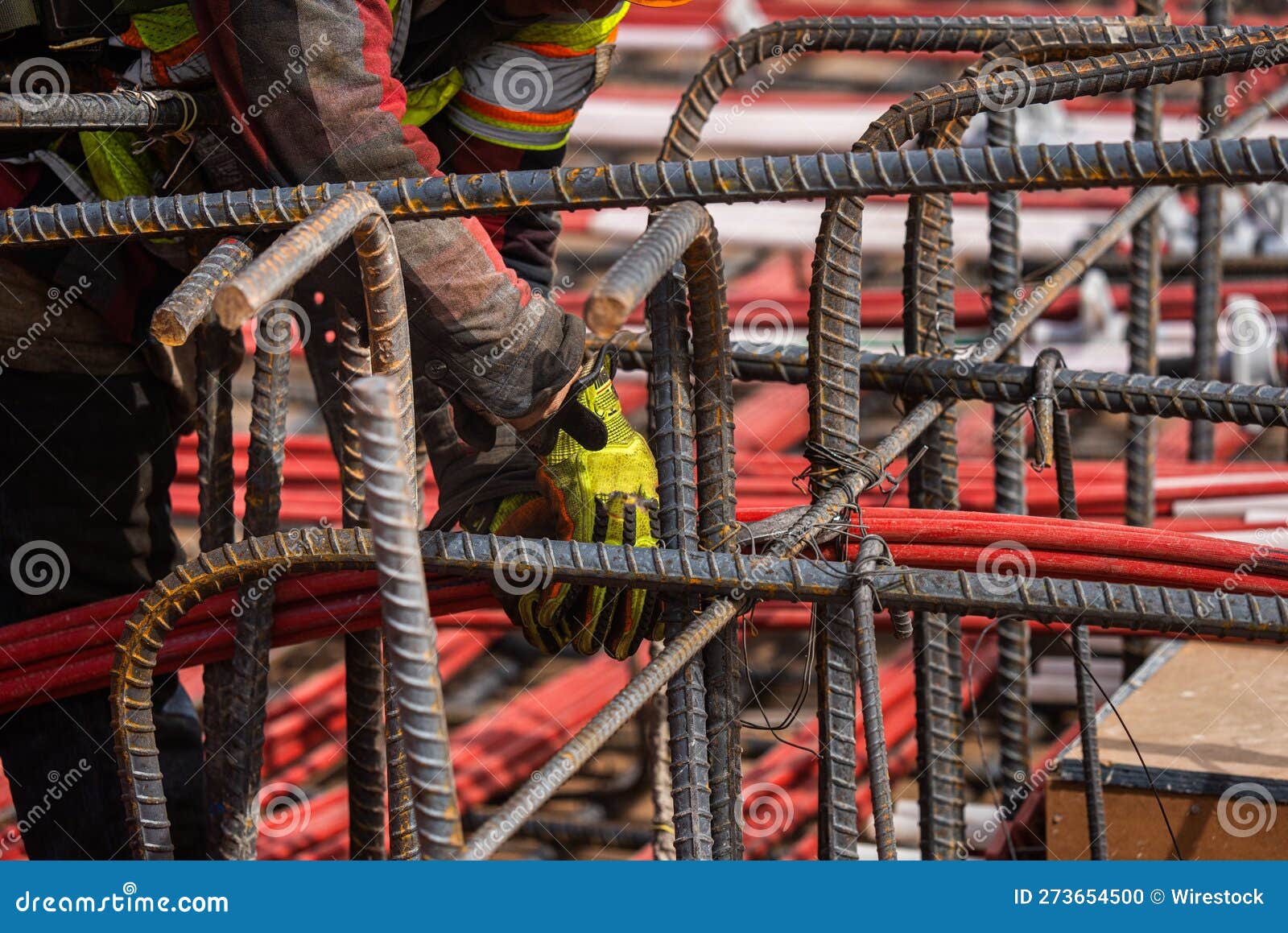 The Construction Worker is Working on the Large Steel Bars at the ...