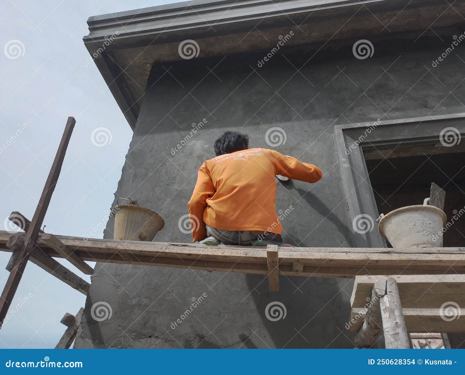 A Construction Worker is Working on Plastering a Wall Editorial Stock ...
