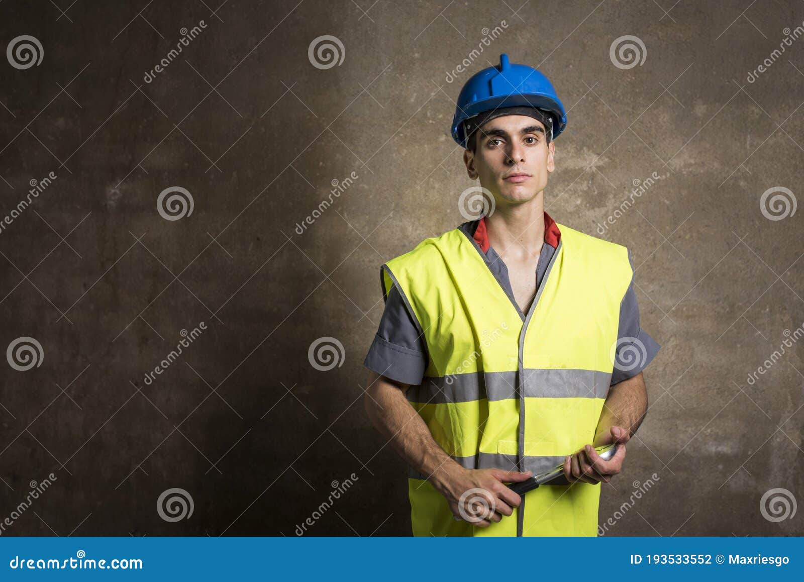 Construction Worker with Wrench and Protective Helmet in Studio Shot ...
