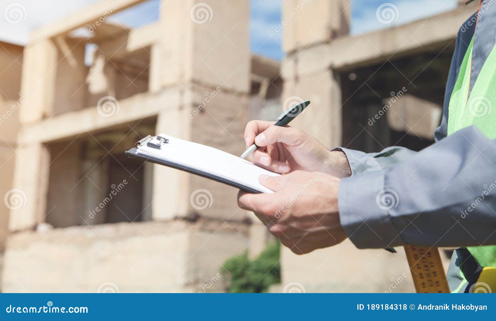 Construction Worker Writing on Clipboard Stock Photo - Image of male ...