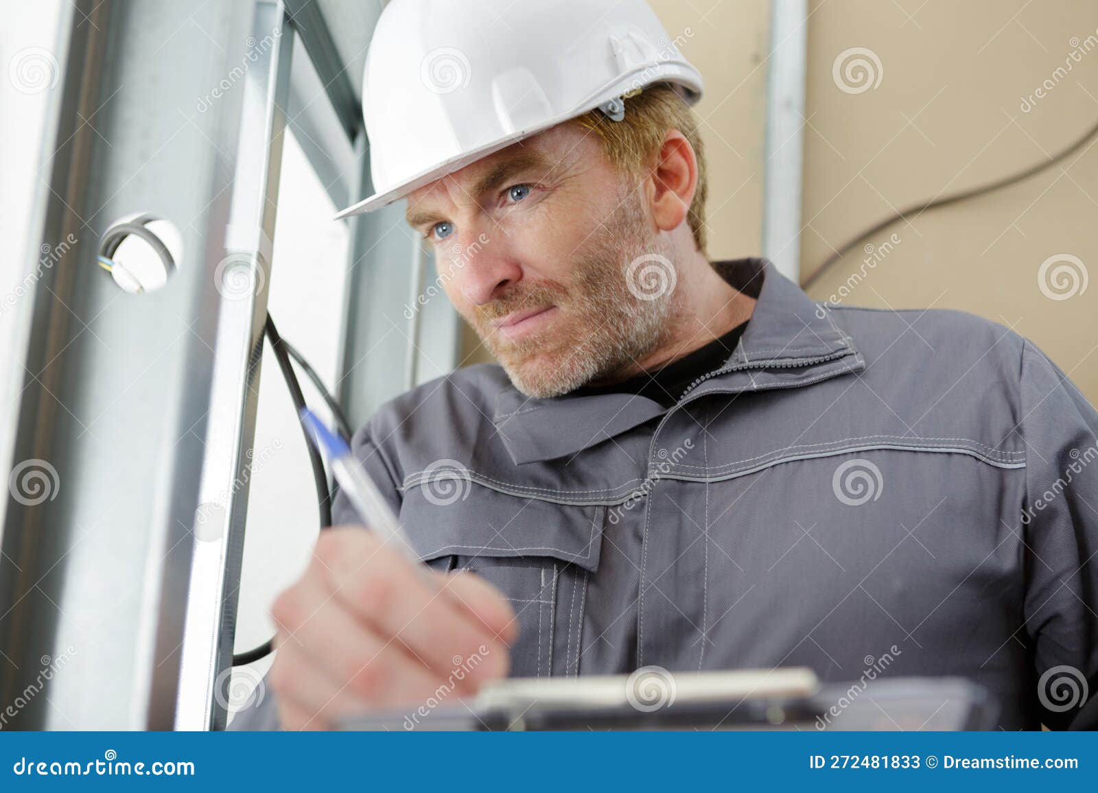 Construction Worker Writing on Clipboard Stock Image - Image of ...