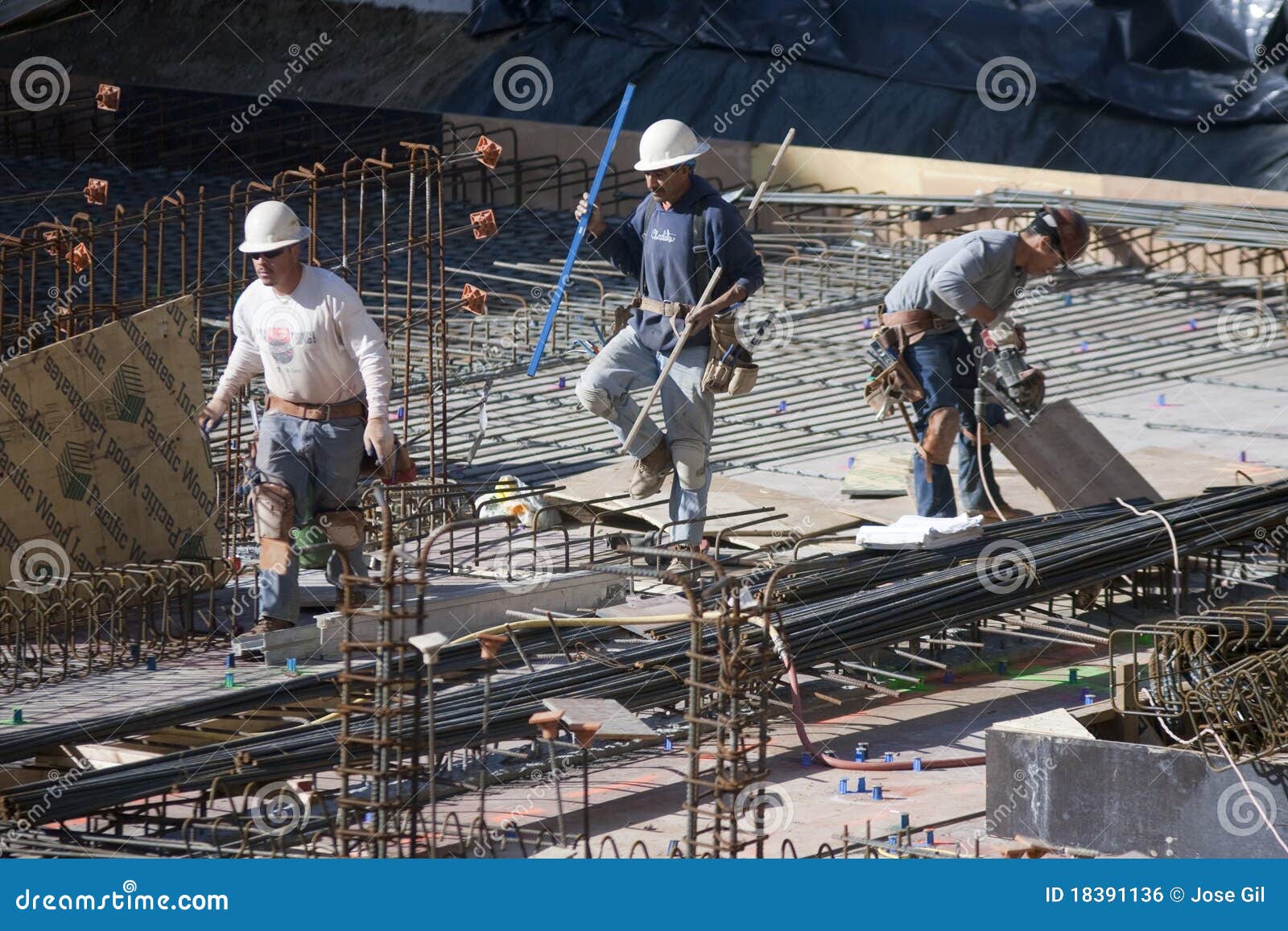 Construction Workers Installing Electrical Cable Tray And Doing Wiring ...