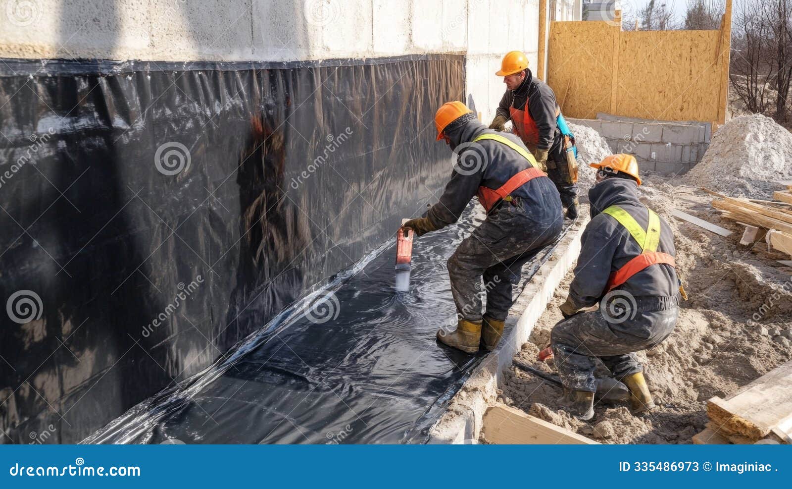 Construction Workers Applying Waterproofing Membrane To Foundation Wall ...