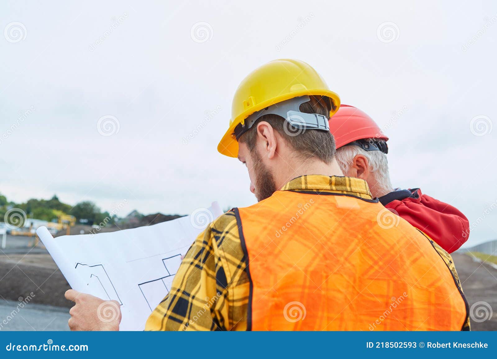 Construction Workers and Architect Discuss Floor Plan Stock Image ...