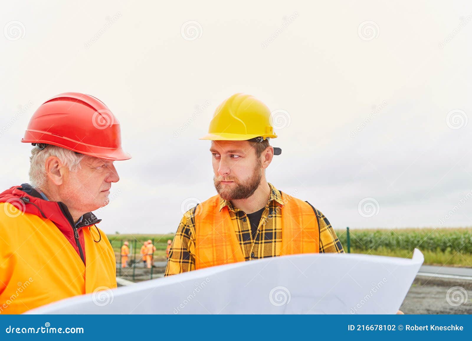 Construction Workers and Architect Plan House Construction with ...
