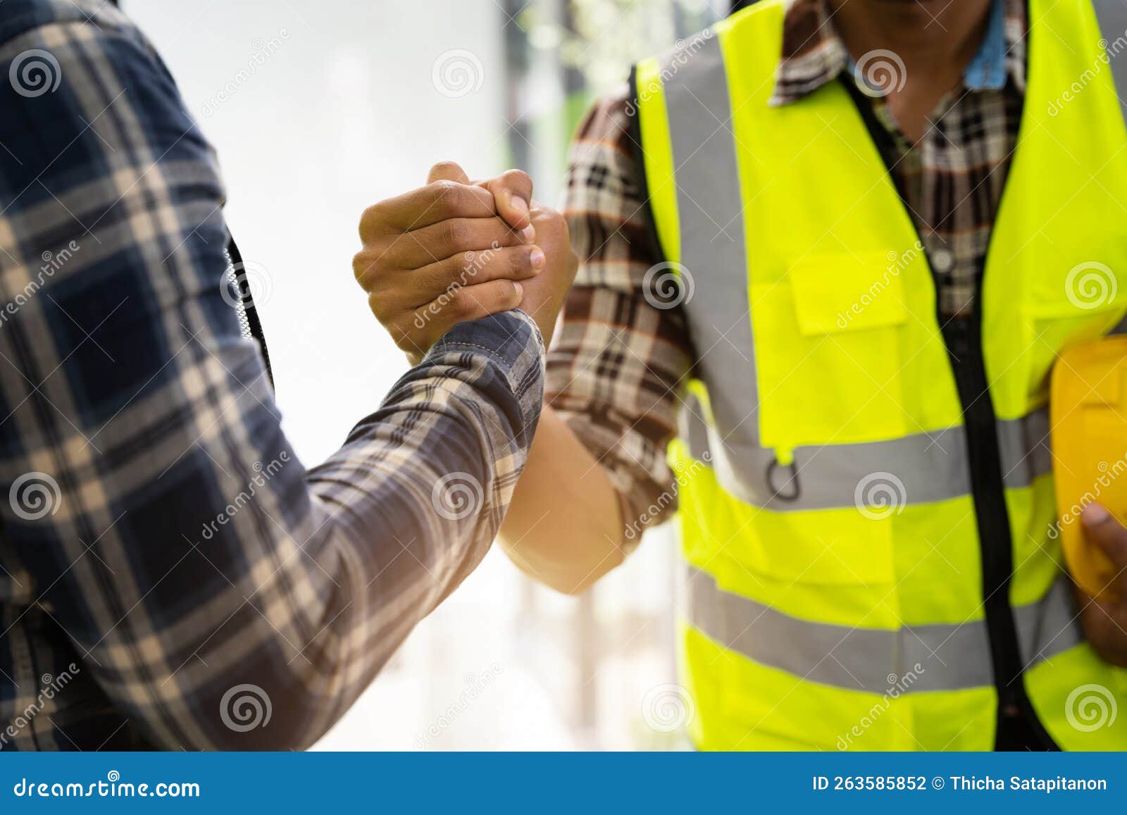 Construction Workers, Architects and Engineers Shake Hands while ...