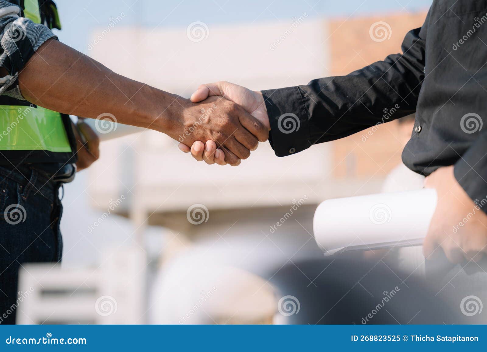 Construction Workers, Architects and Engineers Shake Hands while ...