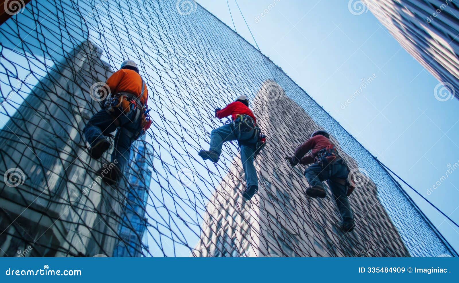 Construction Workers Ascending a Building with Safety Netting Stock ...