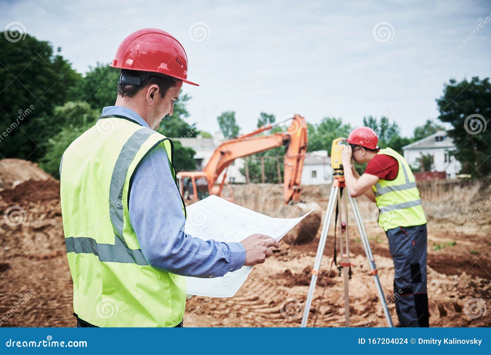 Construction Workers on Building Area. Foreman with Blueprint and ...