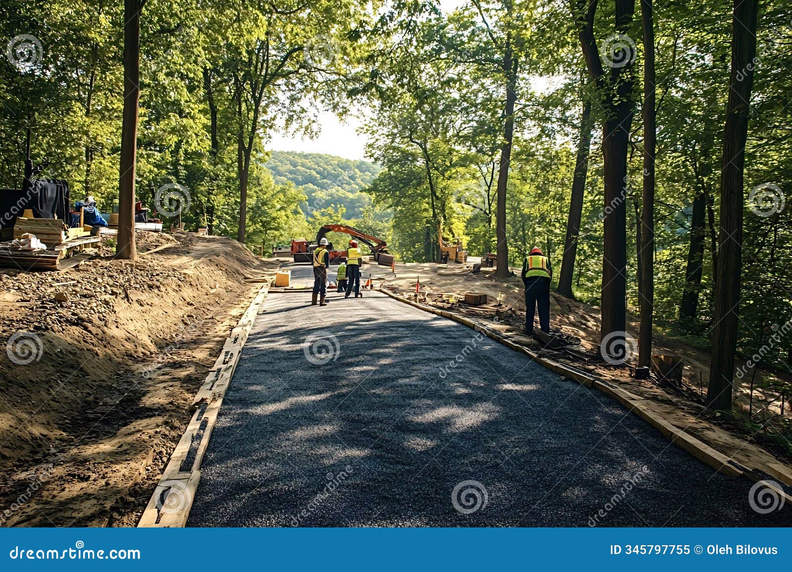 Construction Workers Building New Asphalt Road in Forest Stock Image ...
