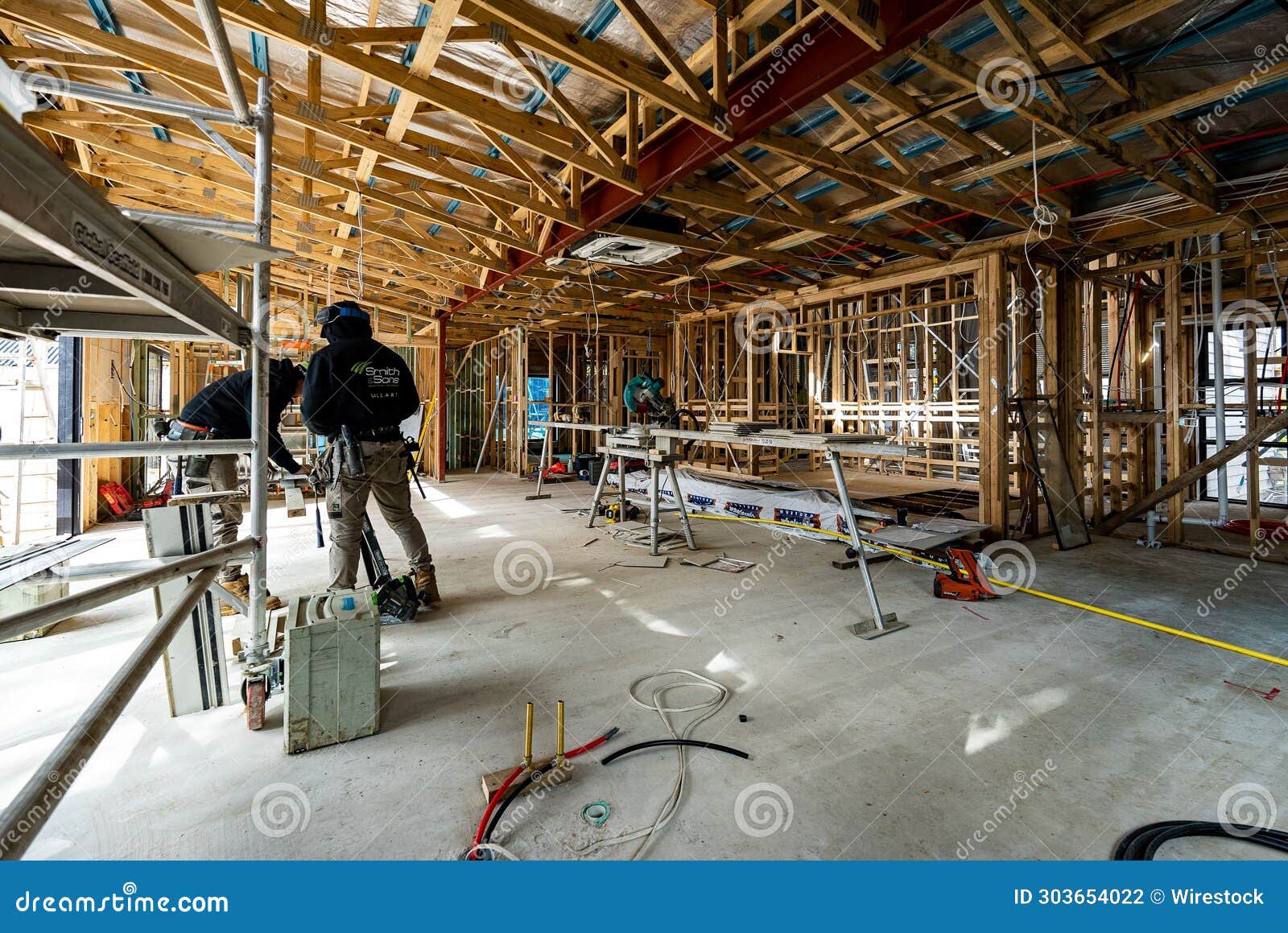 Construction Workers Captured in a House Undergoing Internal Renovation ...