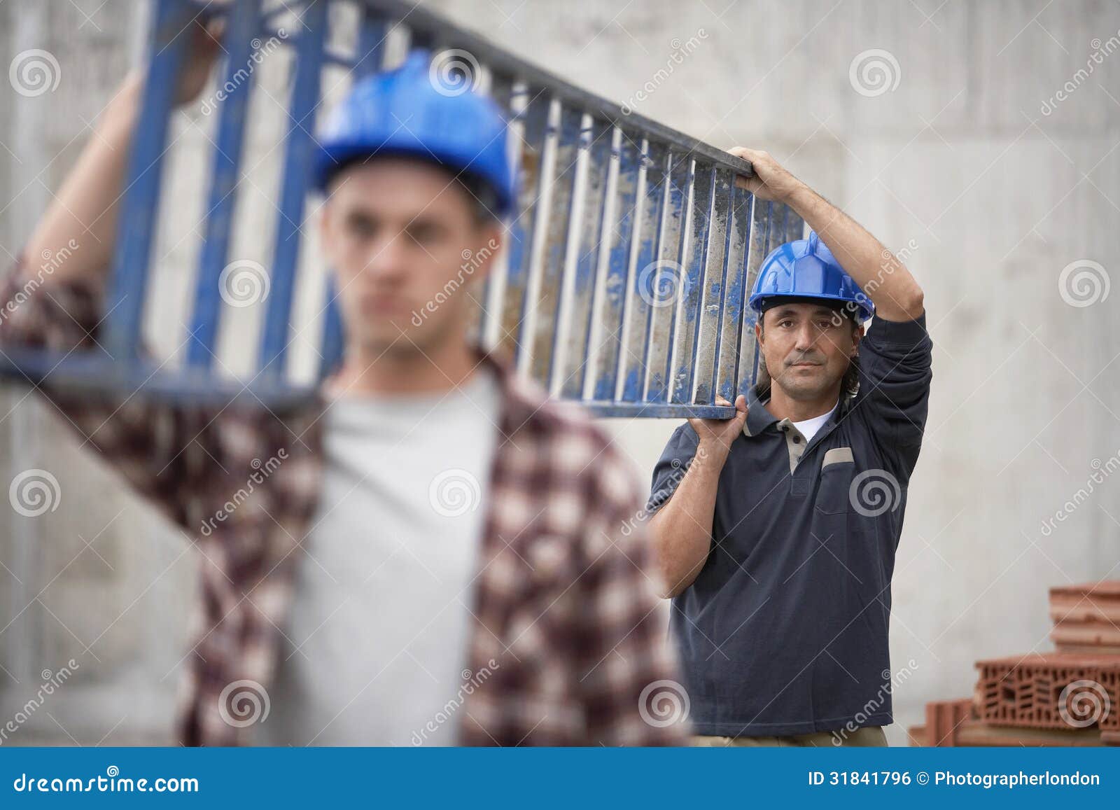 Construction Workers Carrying Ladder Stock Photo - Image of ...