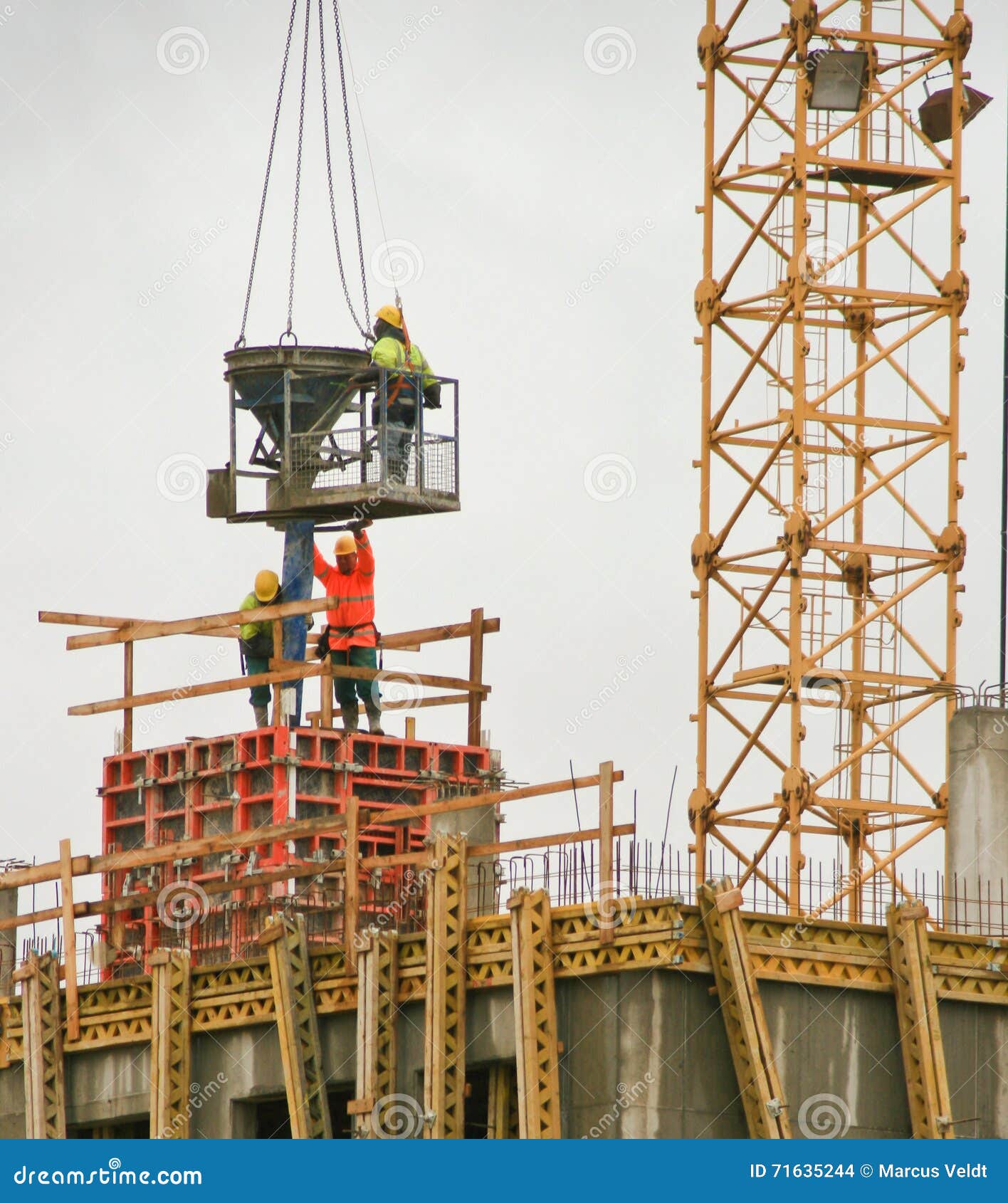 Construction Workers Casting Concrete Lowered from a Crane Editorial ...