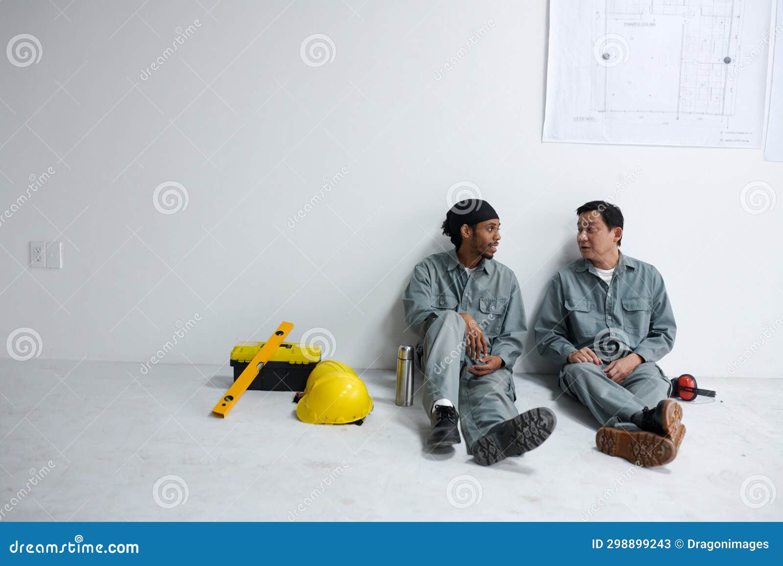 Construction Workers Chatting Stock Image - Image of talk, male: 298899243